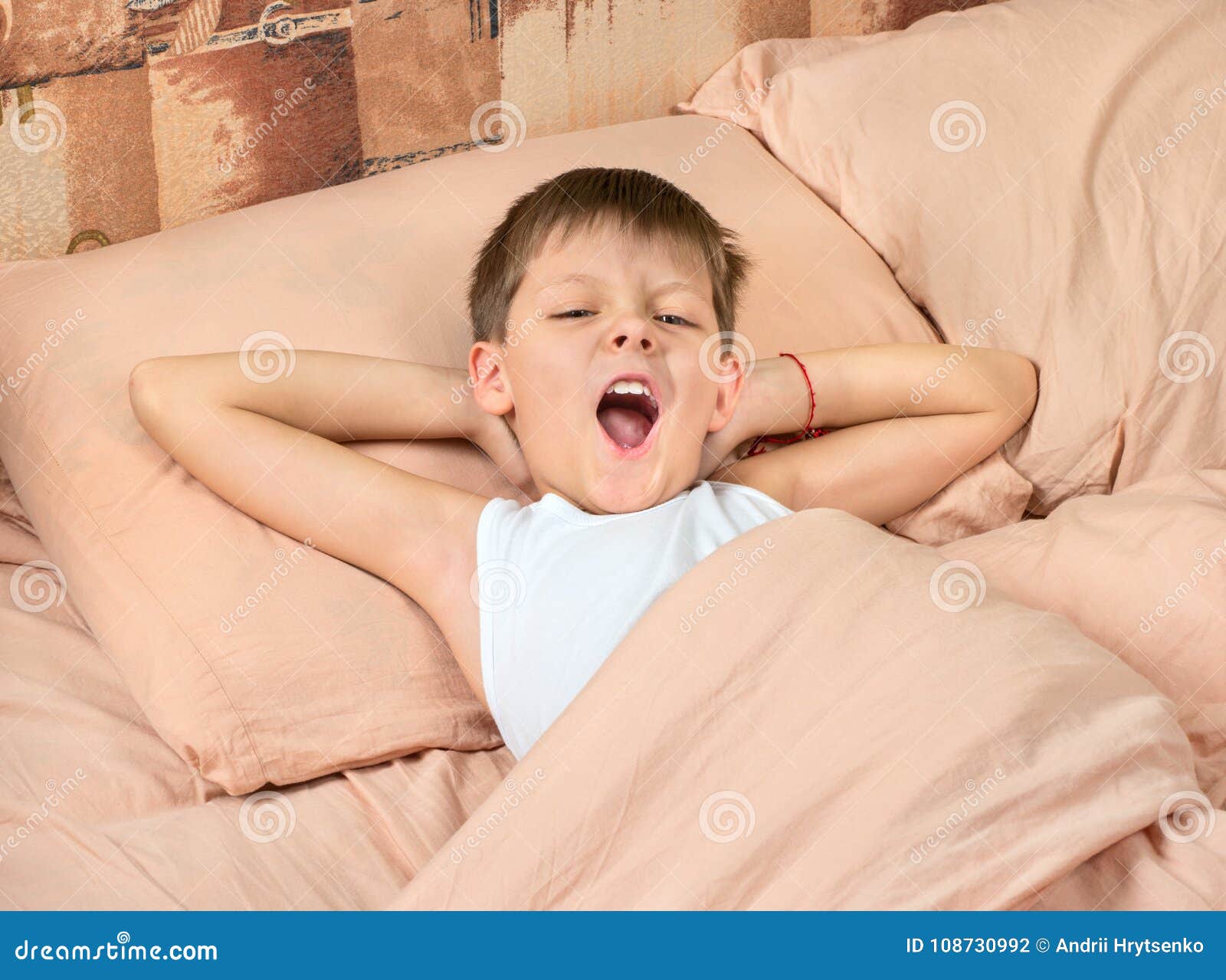 Boy woke up in bed stock photo. Image of lifestyle, emotion - 108730992