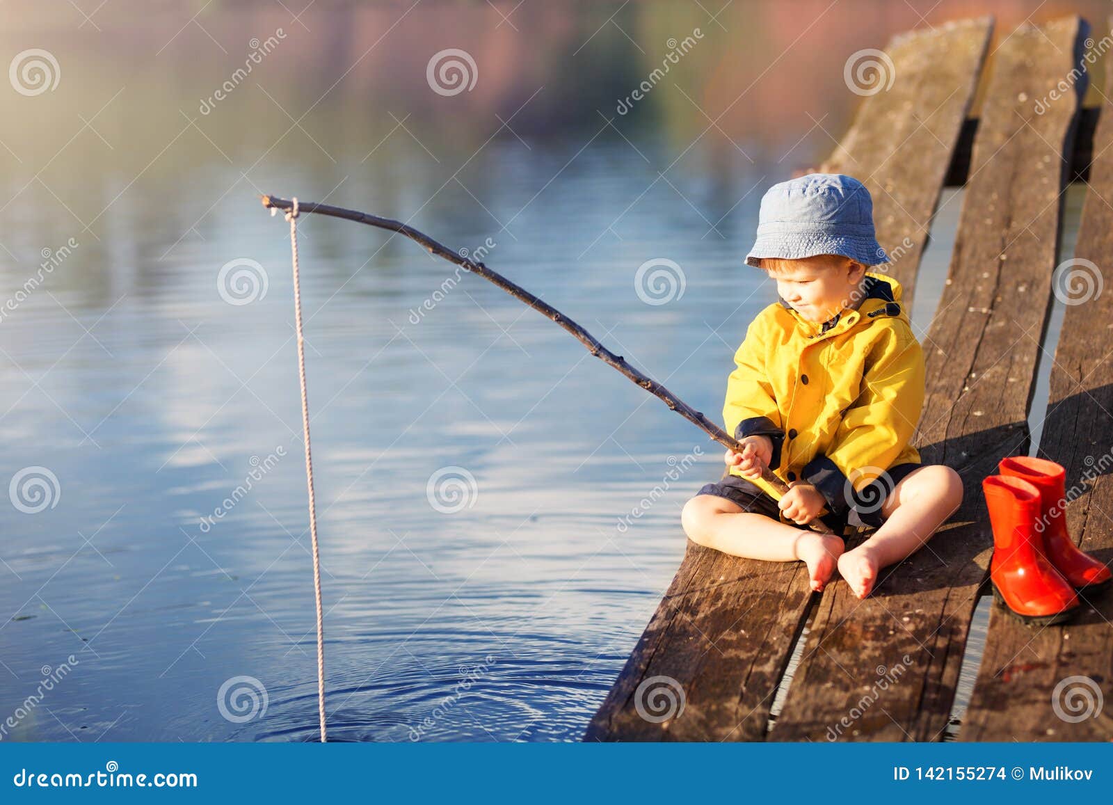 Boy on Wooden Dock with a Fishing Net Stock Photo - Image of little ...
