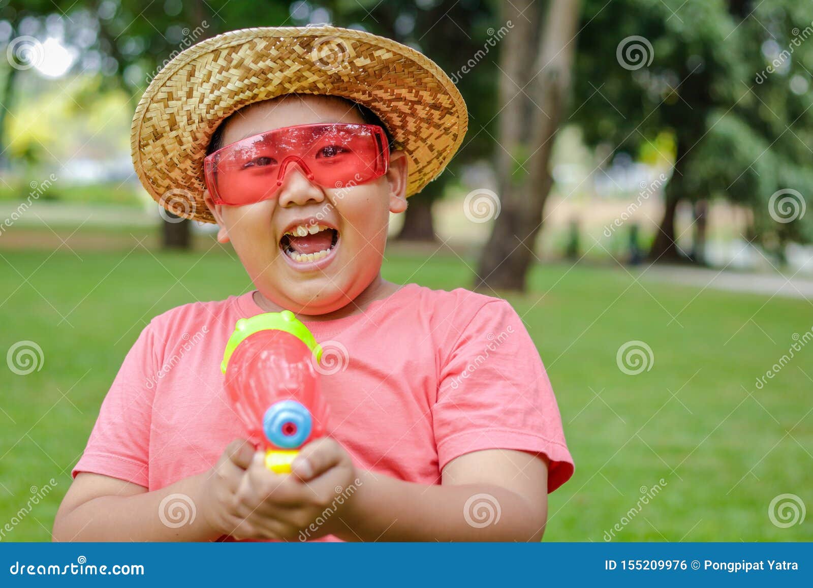 The Boy Wore Red Glasses and Carried Water Guns on Songkran Day. Stock ... The Boy Wore Red Glasses and Carried Water Guns on Songkran Day. Stock ...