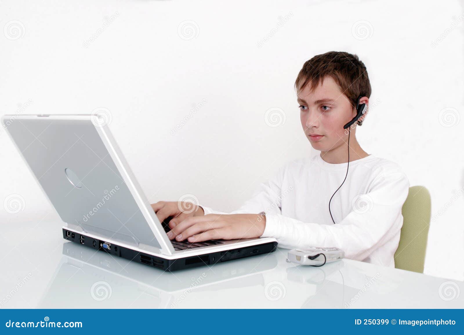 Boy working on computer stock image. Image of tennager - 250399