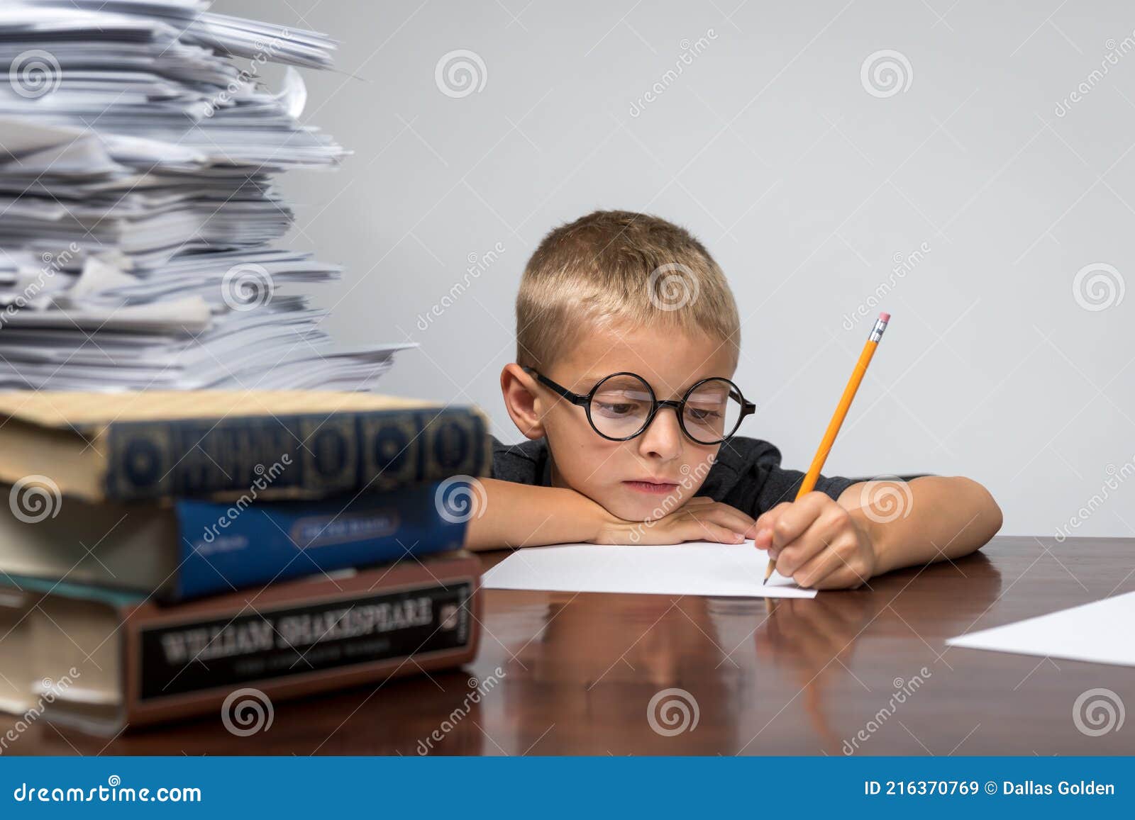 Boy Working on His Stack of Advanced Homework Stock Image - Image of ...