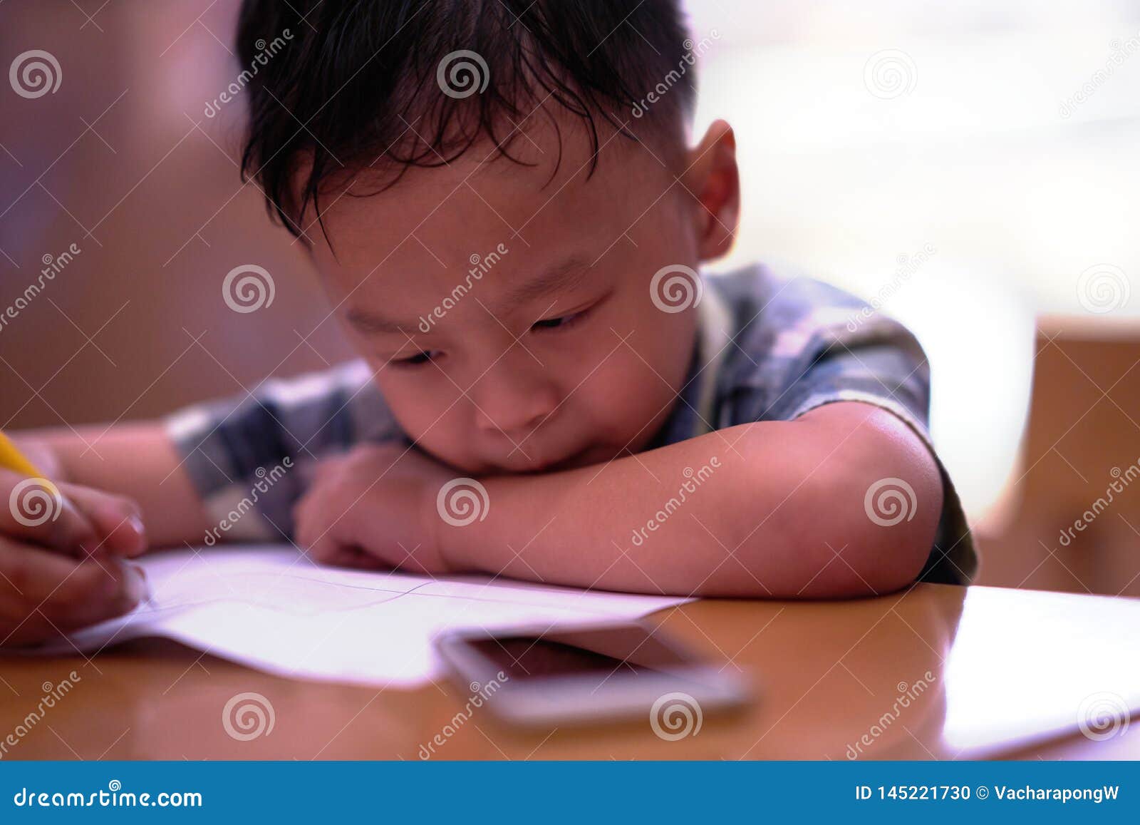 Boy is Working on Homework on Table Stock Photo - Image of bright ...
