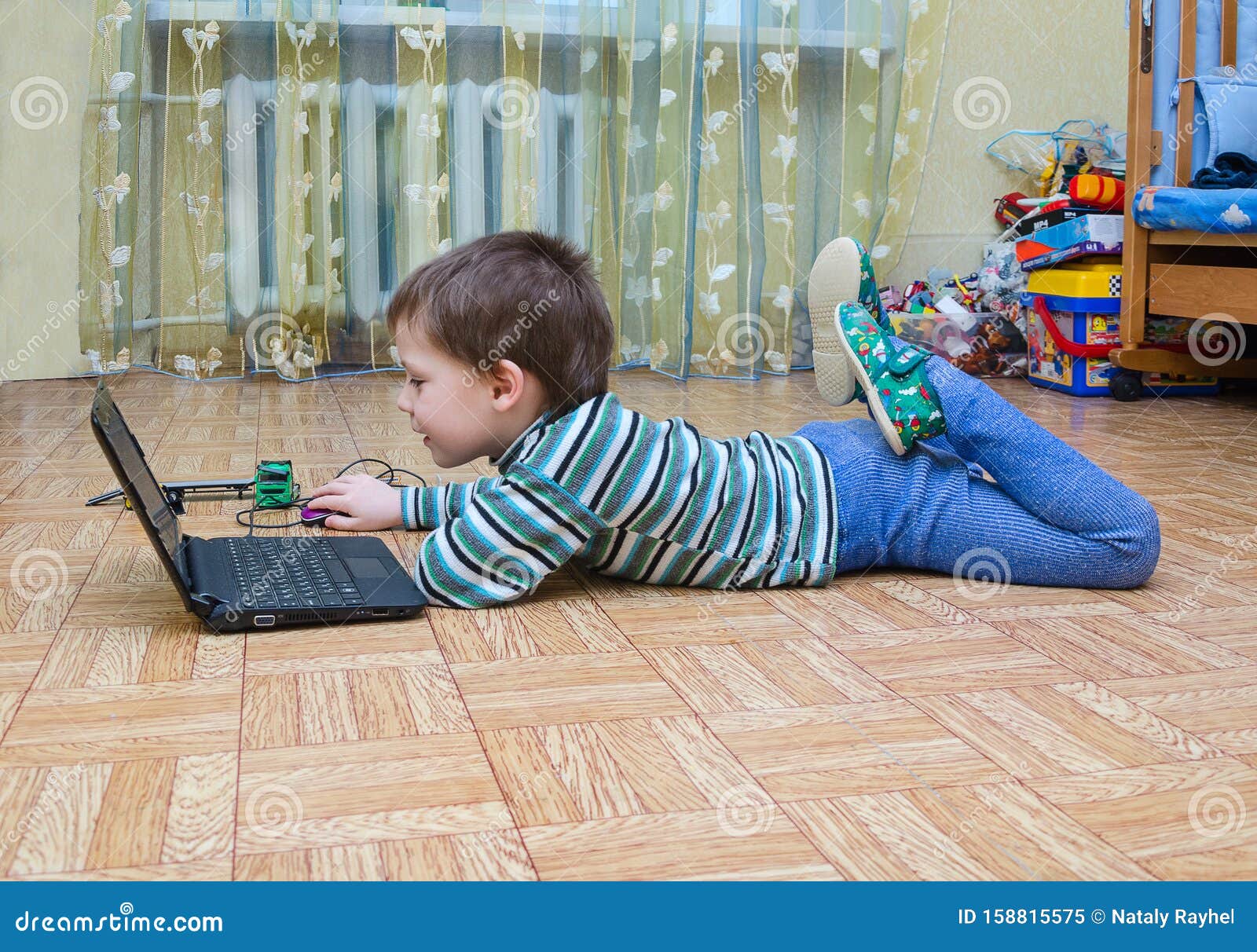 Boy working on a laptop editorial image. Image of preschool - 158815575