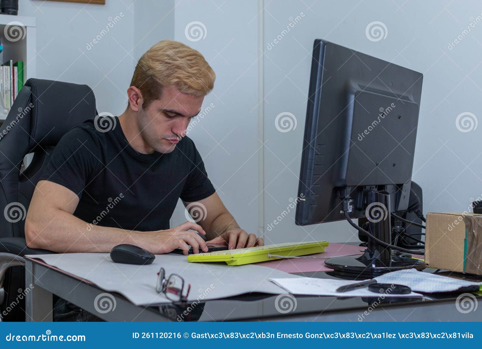 Boy Working in the Office on the Computer with a Concentrated Face ...