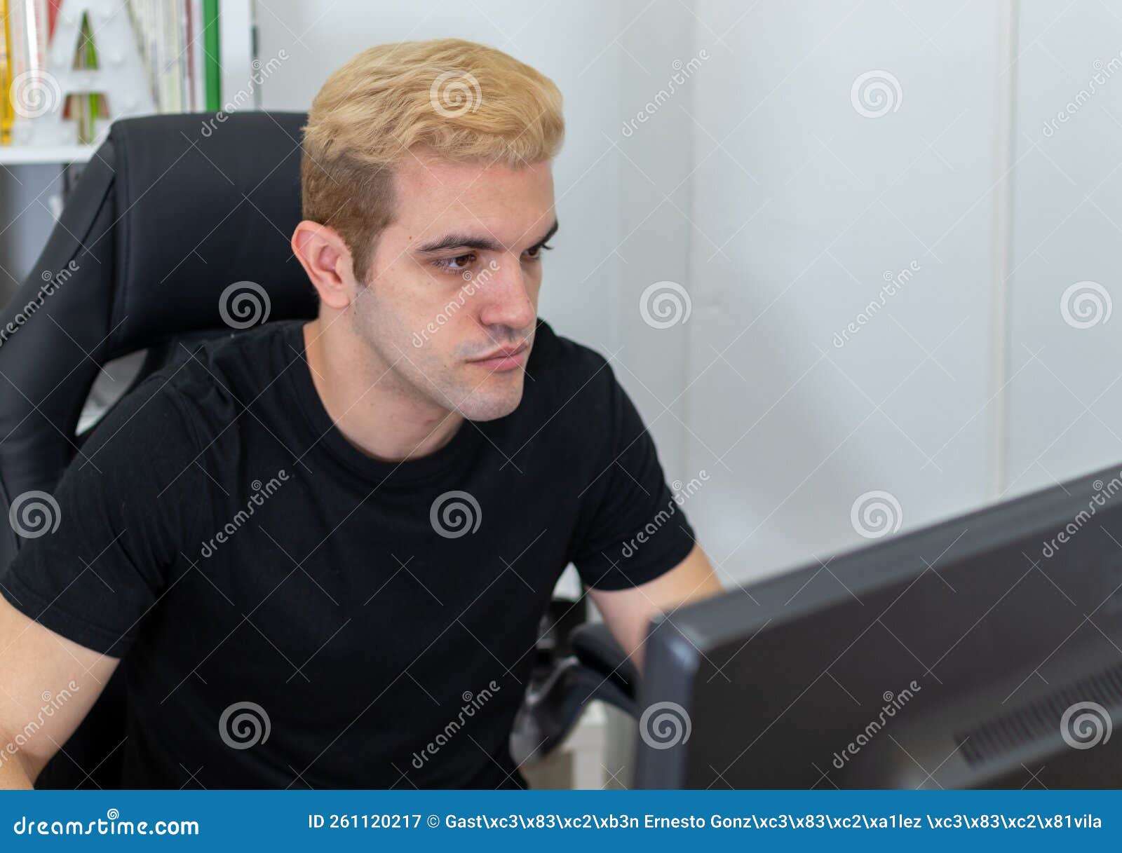 Boy Working in the Office on the Computer with a Concentrated Face ...