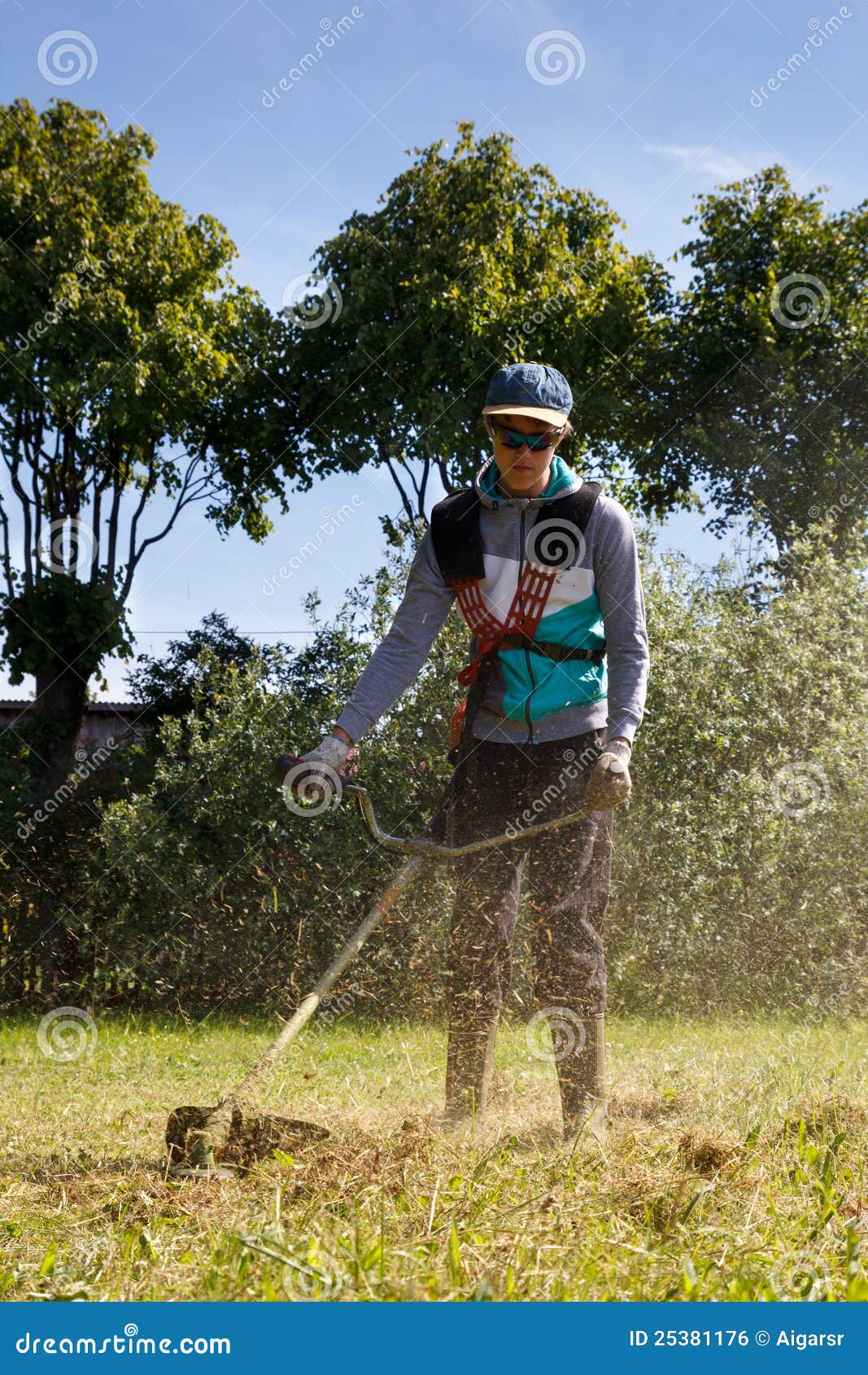 Boy working on a trimmer stock photo. Image of lawn, field - 25381176
