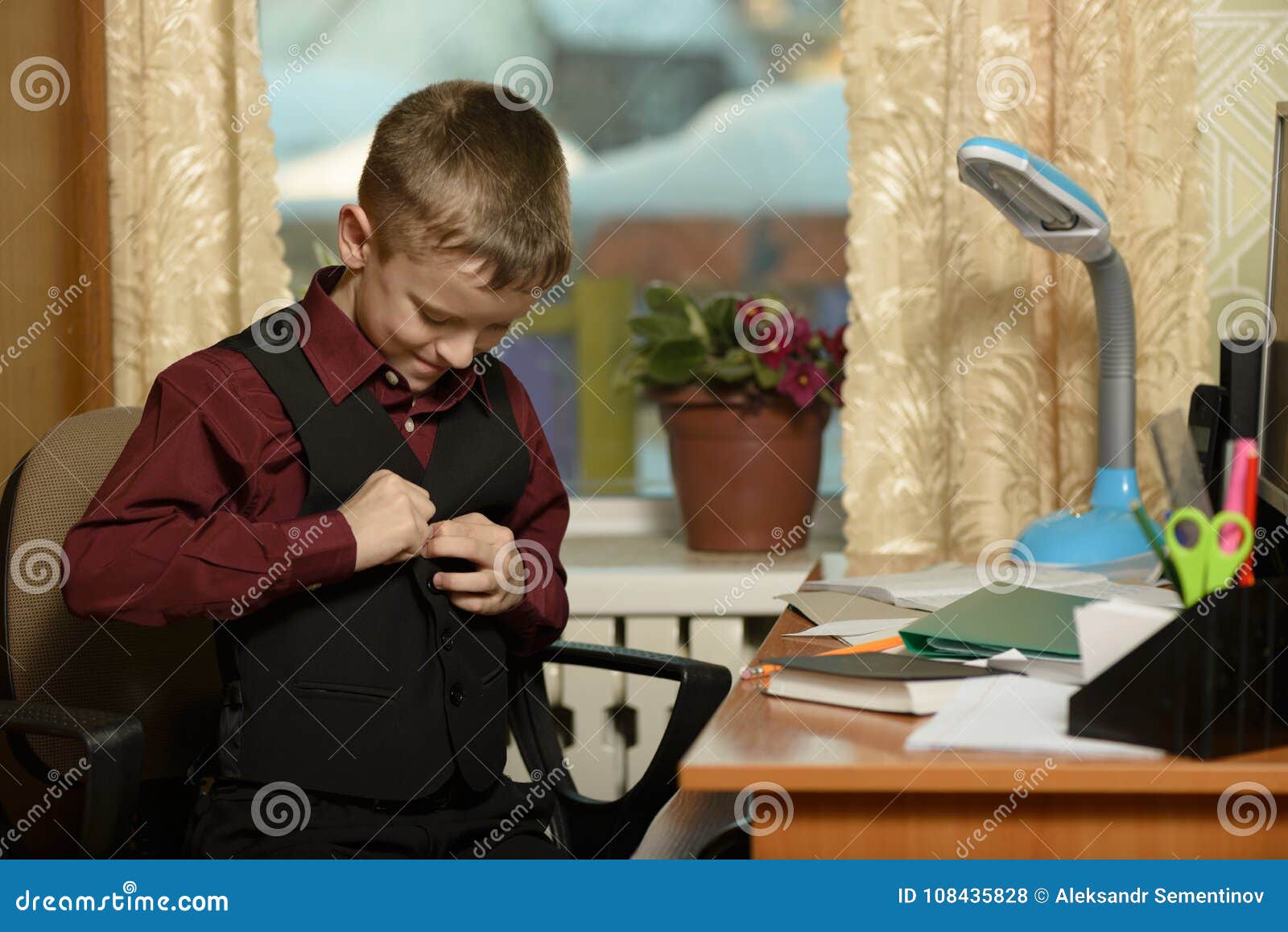 The Boy Works in His Office on a Personal Computer.he Fastens Th Stock ...
