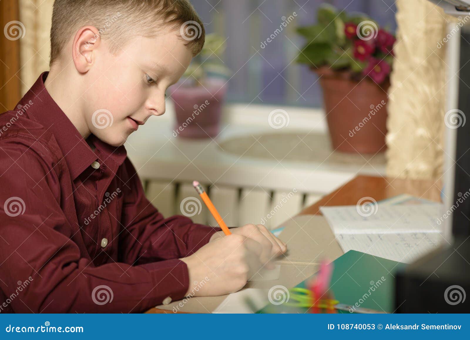 The Boy Works in His Office on a Personal Computer.Writes the Te Stock ...