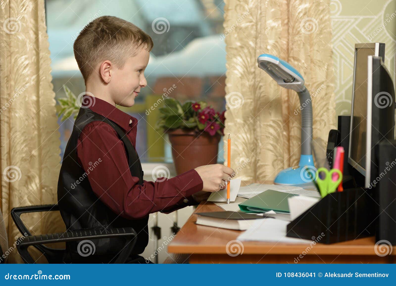 The Boy Works in His Office on a Personal Computer.he Writes Wit Stock ...