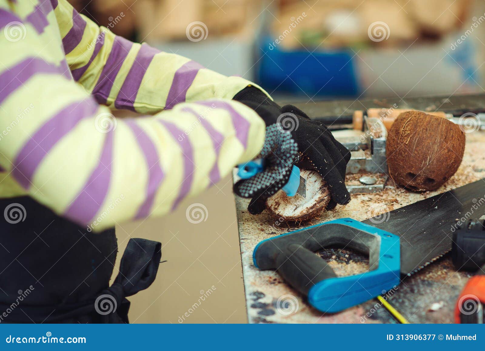 Boy in the Workshop Makes Crafts with Coconut. Young Carpenter Working ...