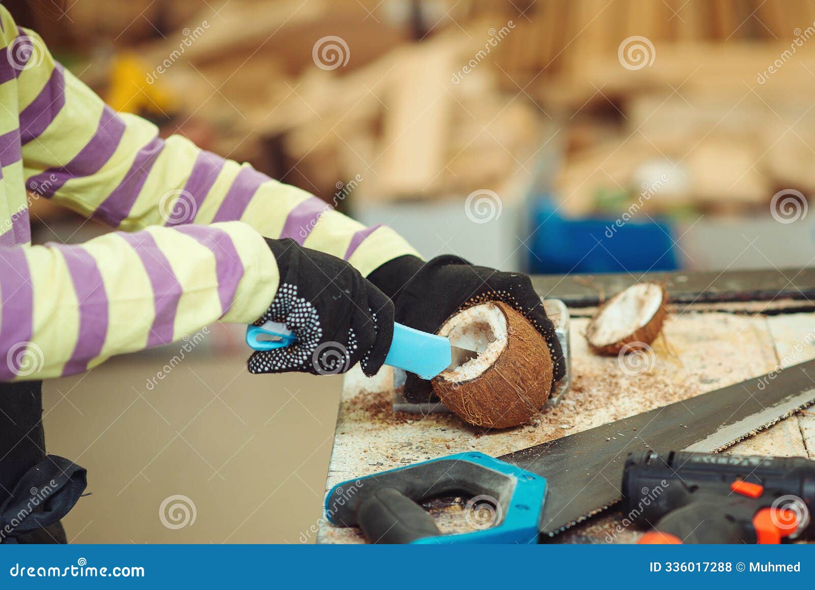 Boy in the Workshop Makes Crafts with Coconut. Young Carpenter Working ...
