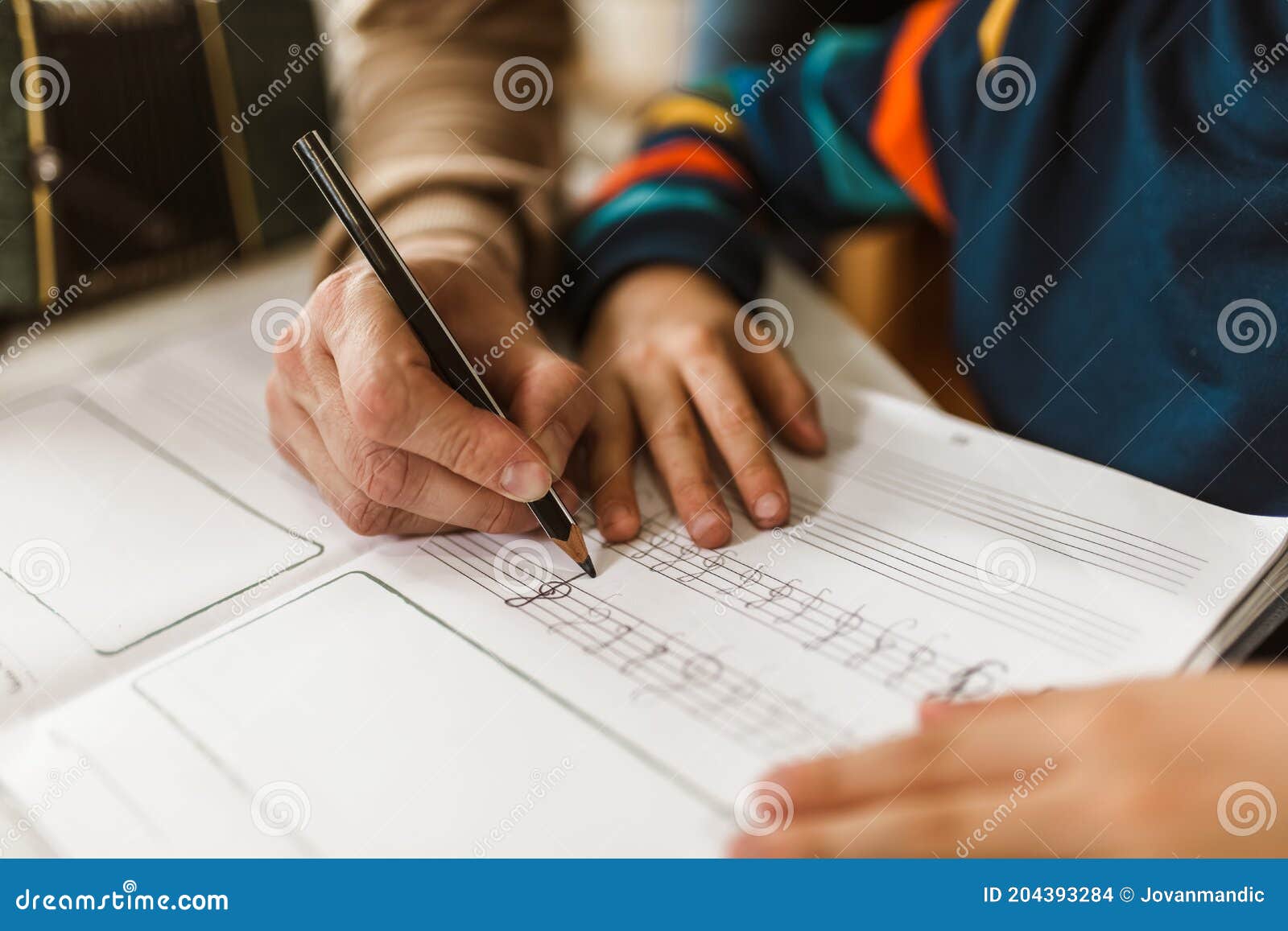 Boy Writes Musical Notes And Violin Key At Home Online Course On Laptop ...
