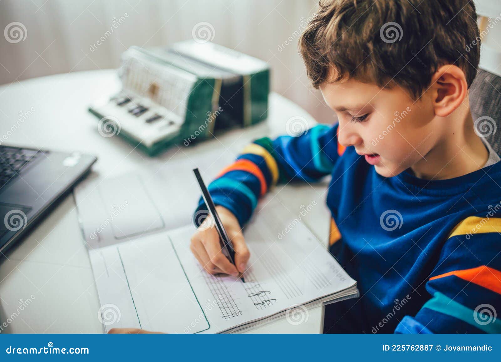 Boy Writes Musical Notes and Violin Key at Home Stock Image - Image of ...