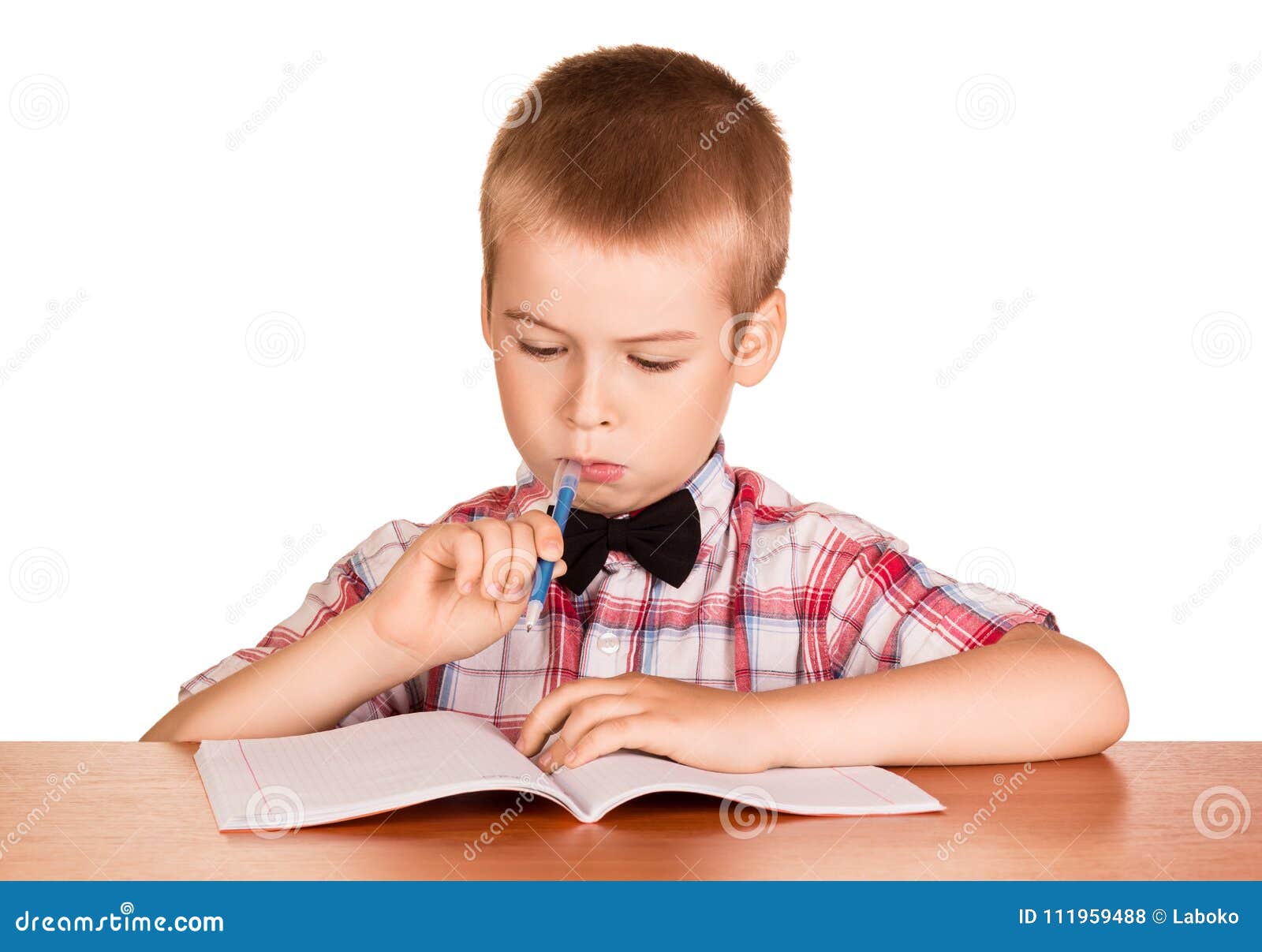 Boy Writes in Notebook, Sitting at Desk Isolated on White Stock Photo ...