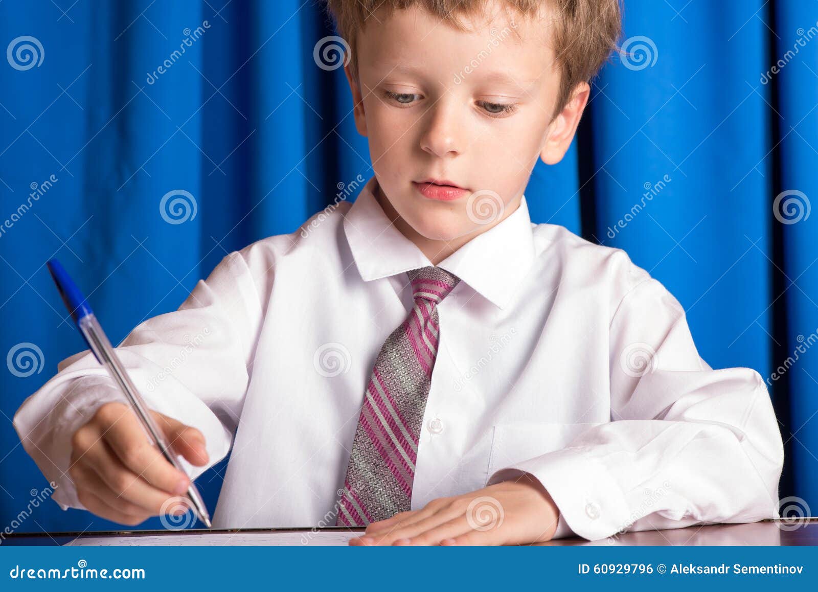Boy Writes on a Sheet of Paper Stock Photo - Image of studious ...