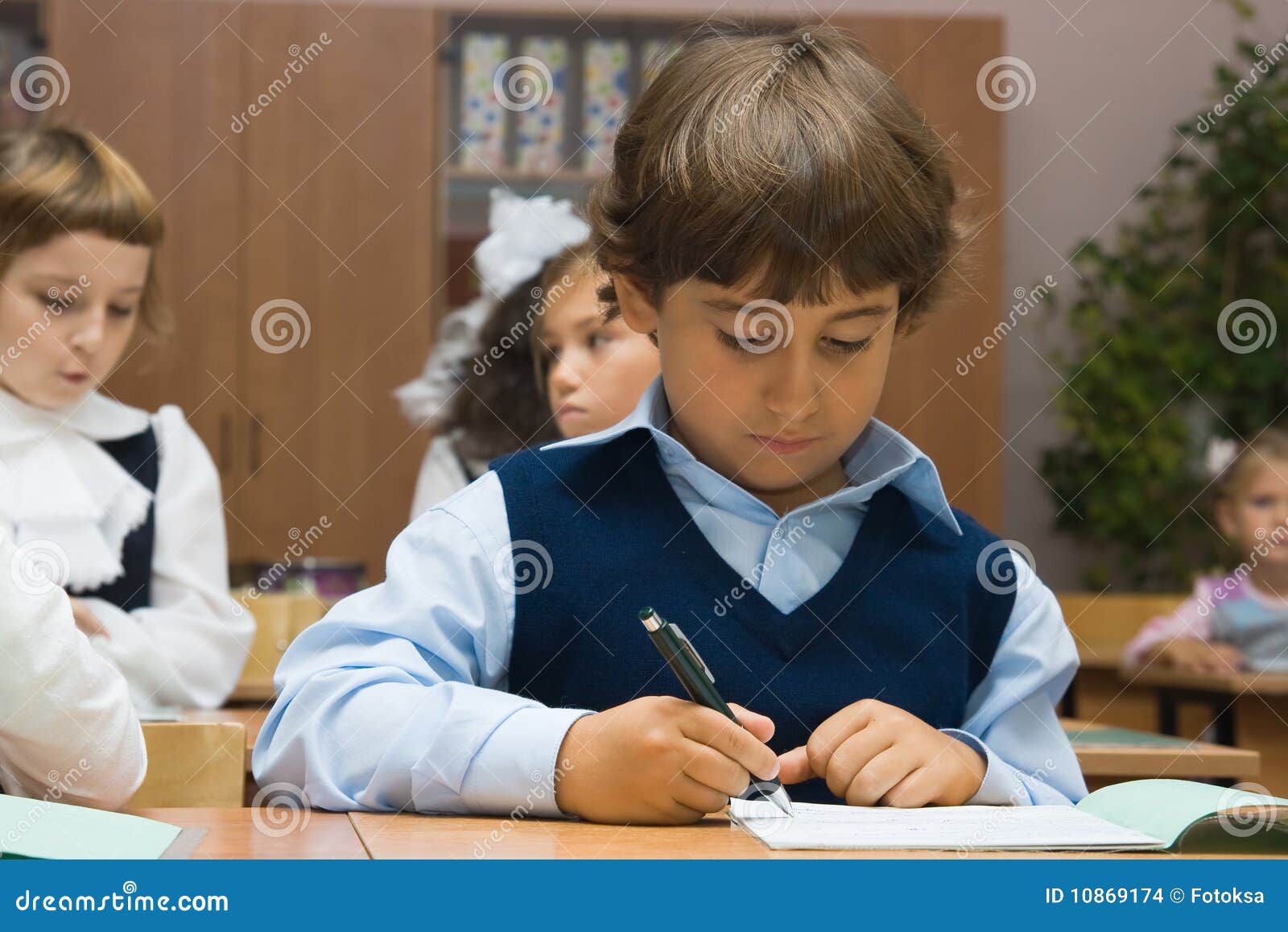 The Boy Writes To Writing-books Stock Photo - Image of classroom ...