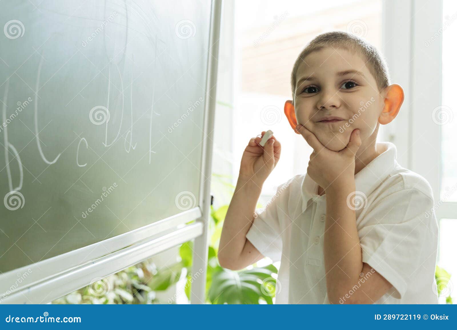 Boy Writing Abc Letters on the Green Chalkboard Stock Image - Image of ...