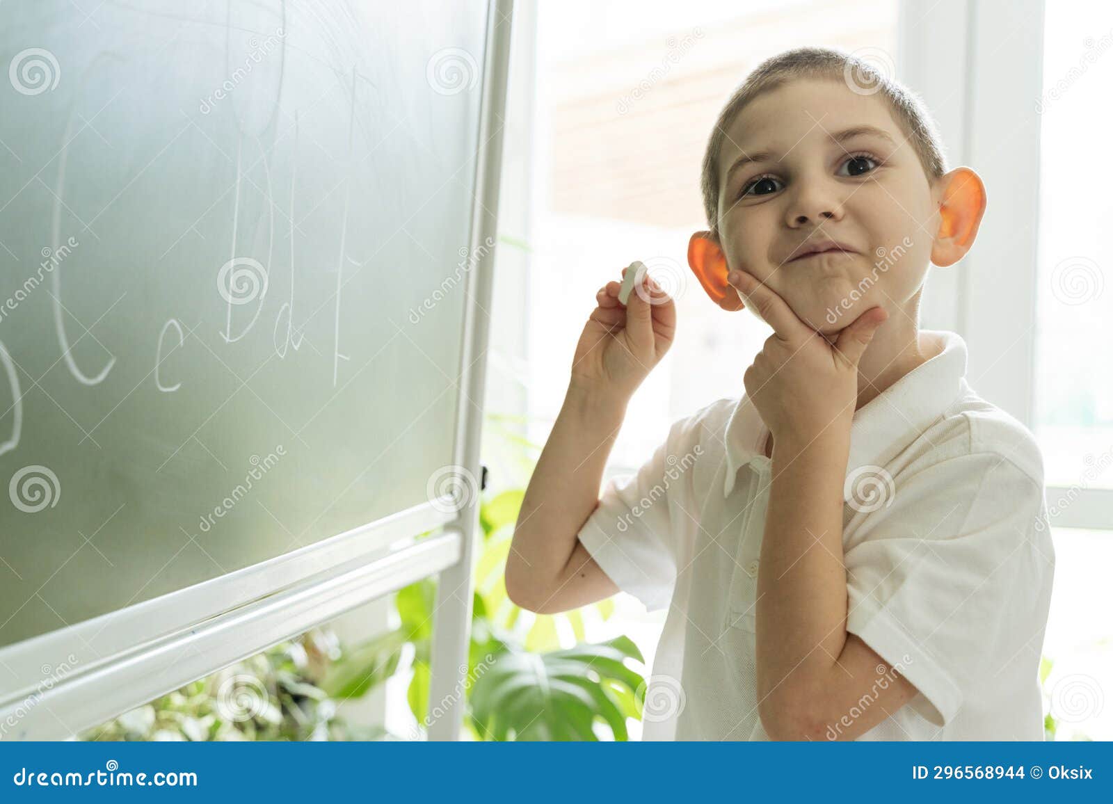 Boy Writing Abc Letters on the Green Chalkboard Stock Photo - Image of ...