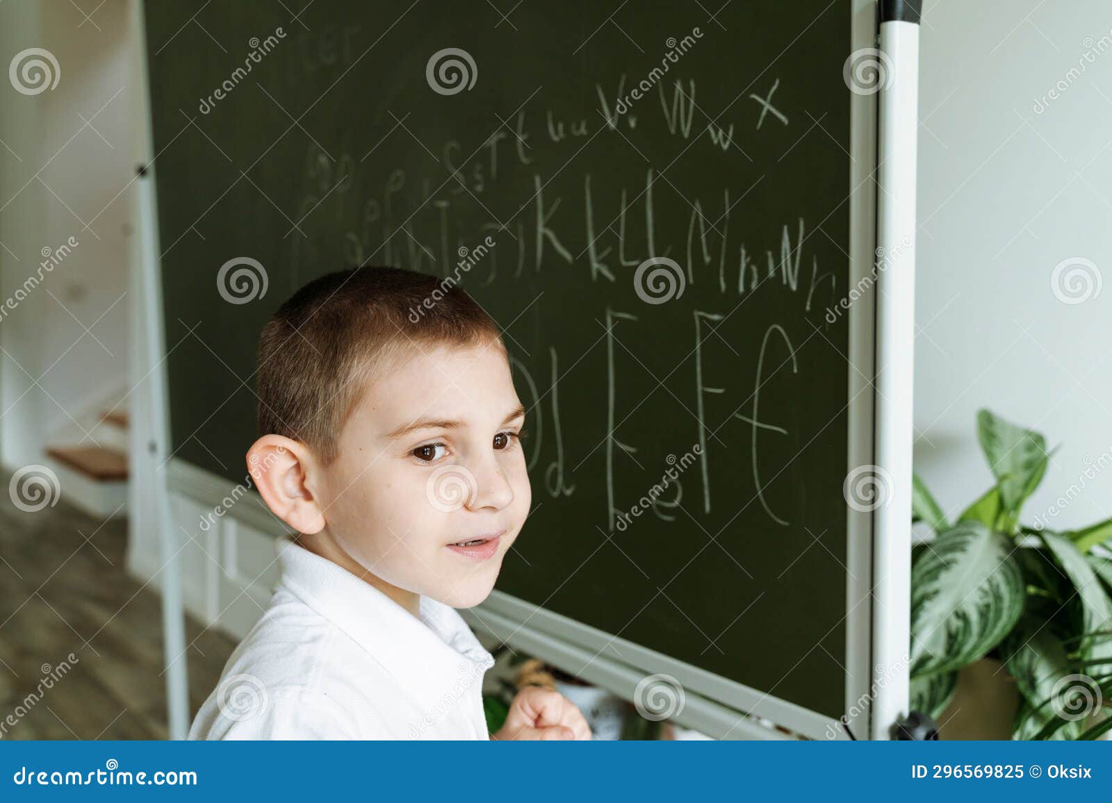 Boy Writing Abc Letters on the Green Chalkboard Stock Image - Image of ...