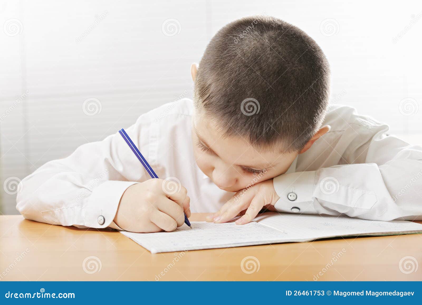 Boy Writing Bending Over Copybook Stock Image - Image of horizontal ...