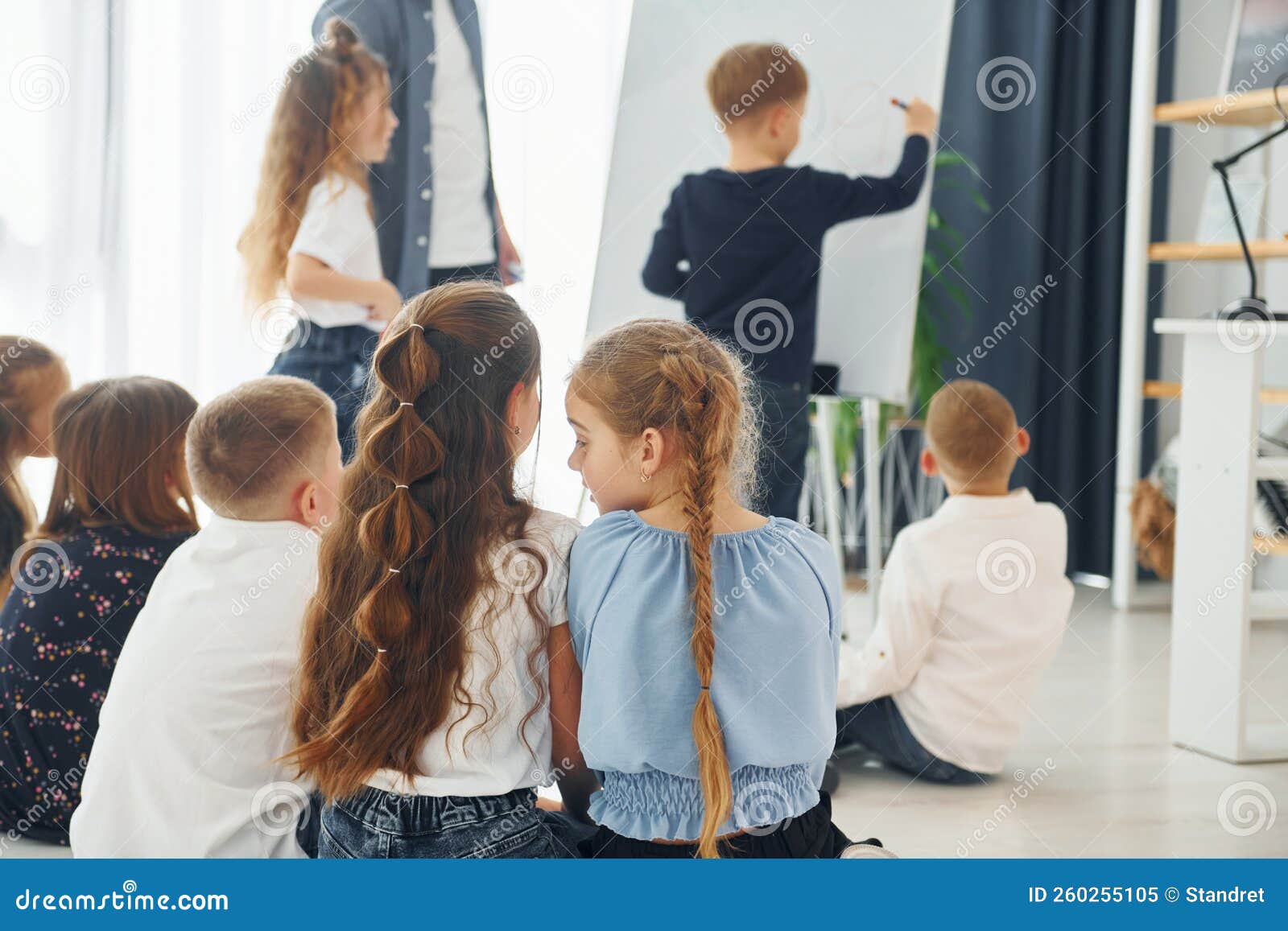 Boy Writing on the Board. Group of Children Students in Class at School ...