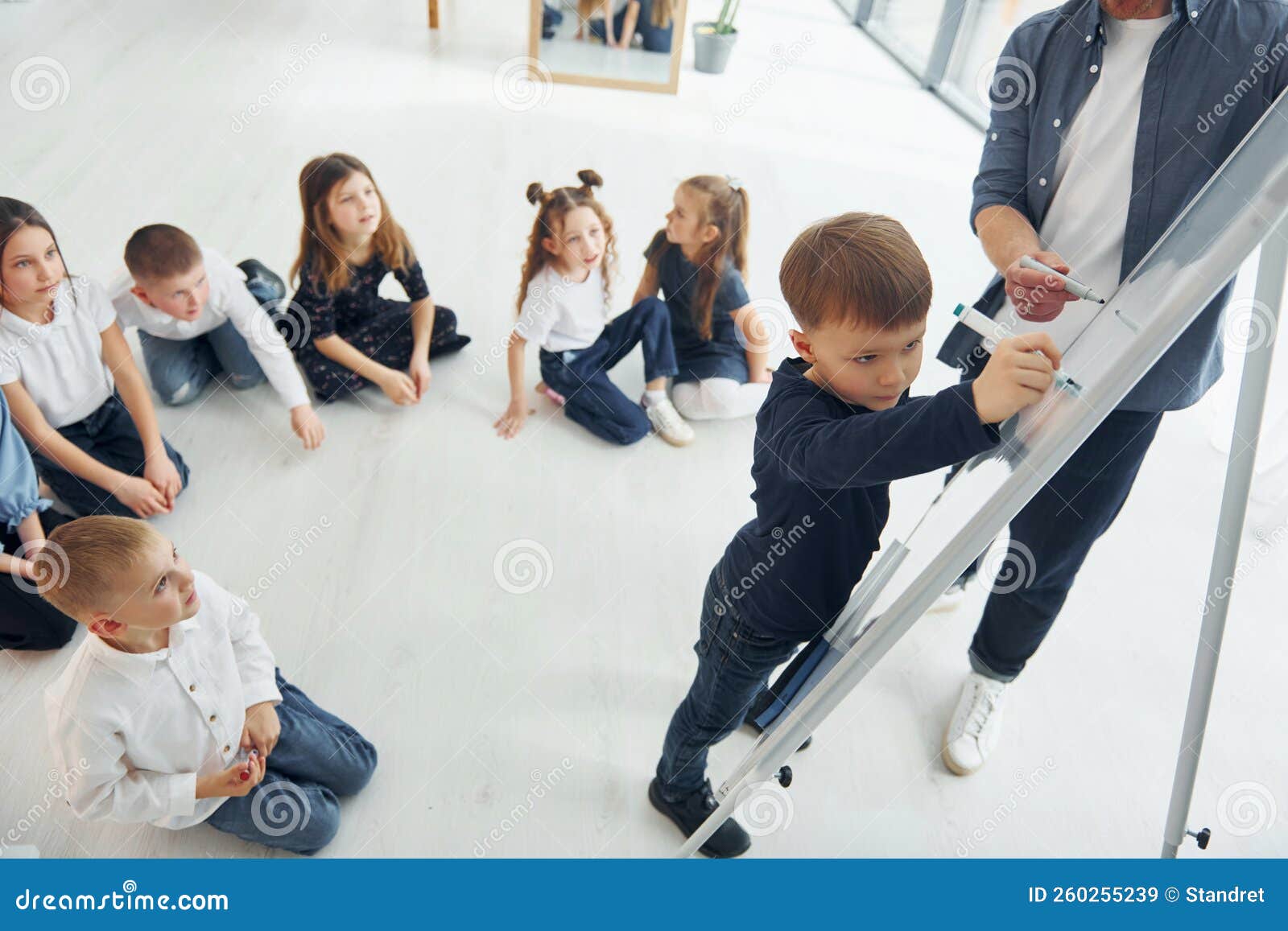 Boy Writing on the Board. Group of Children Students in Class at School ...