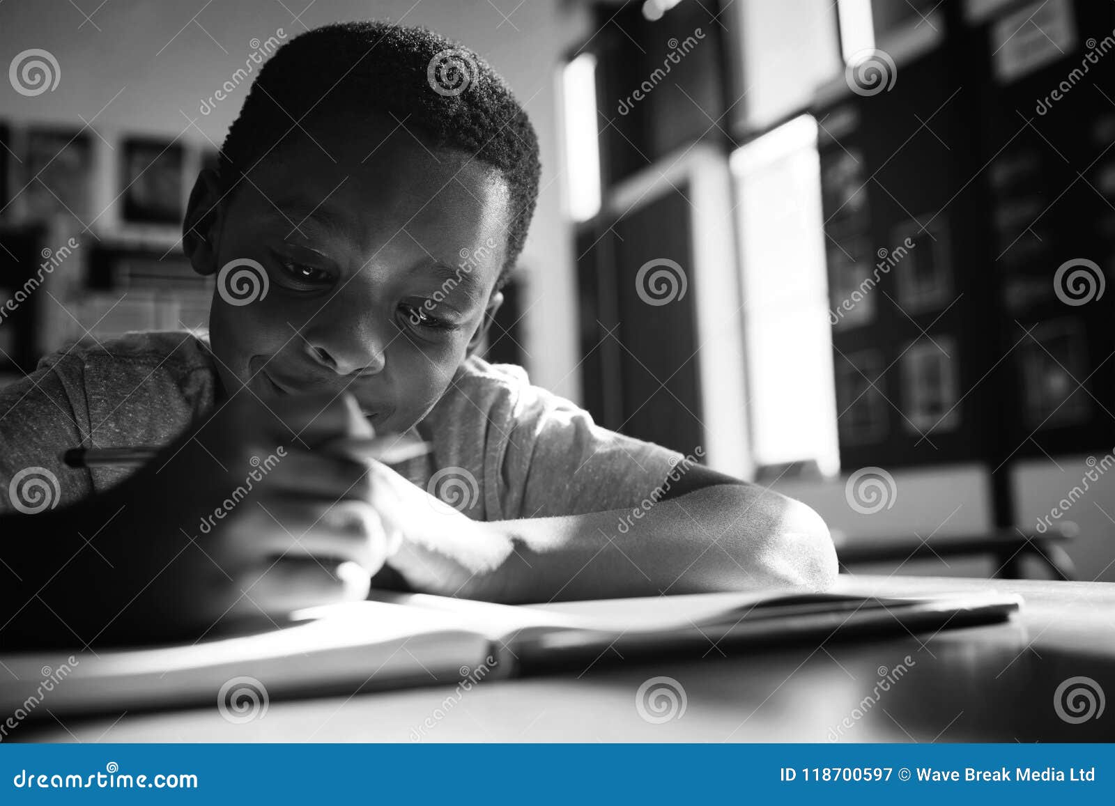 Boy writing in book stock image. Image of shot, copy - 118700597