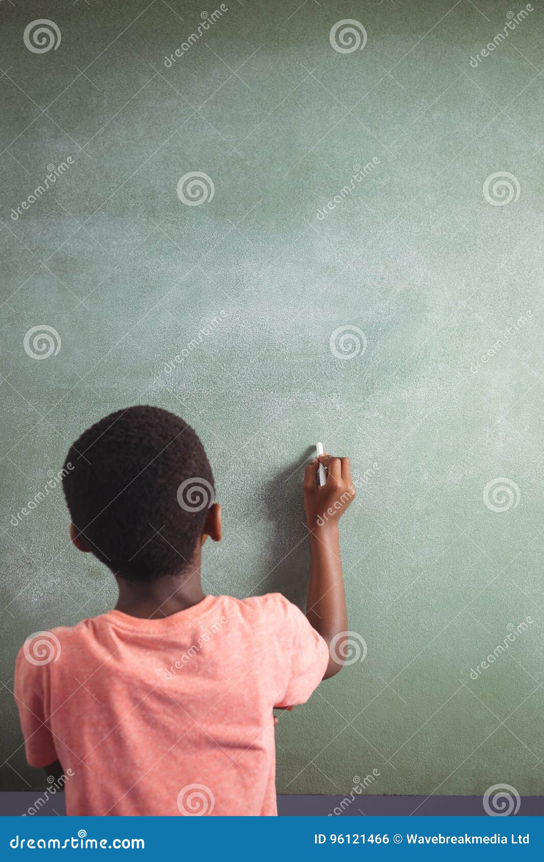 Boy Writing with Chalk on Greenboard Stock Photo - Image of rear ...