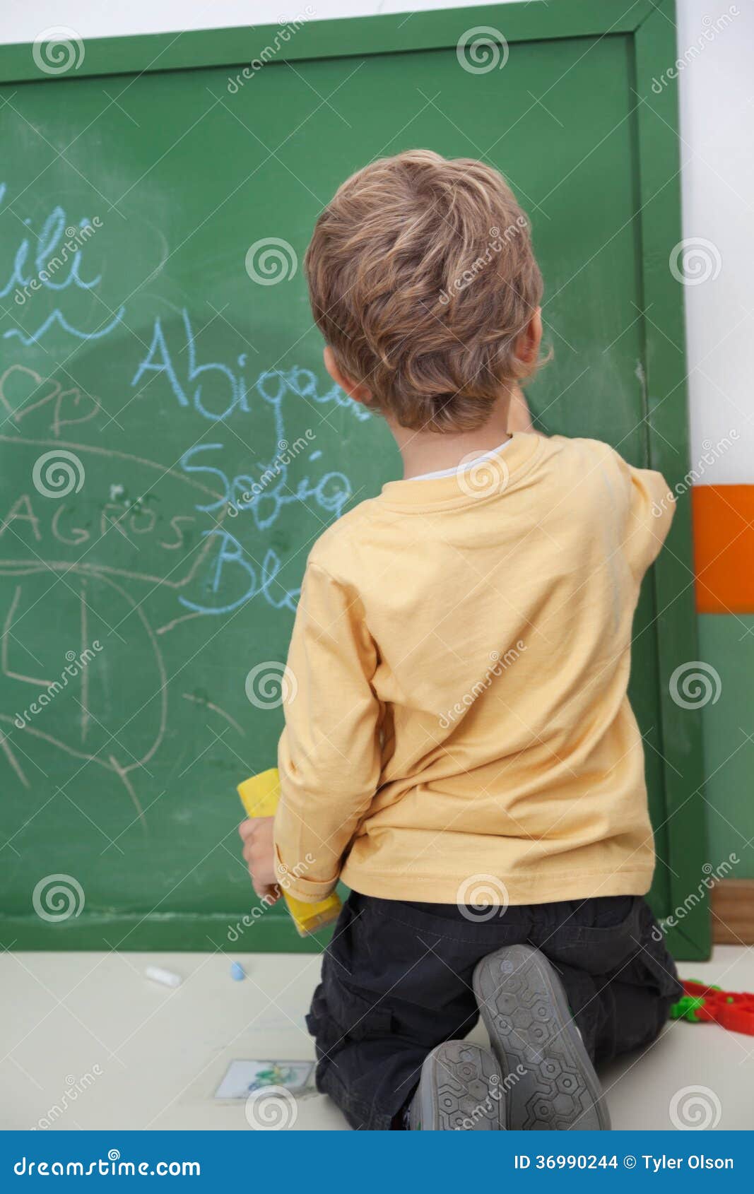 Boy Writing on Chalkboard at Kindergarten Stock Photo - Image of class ...