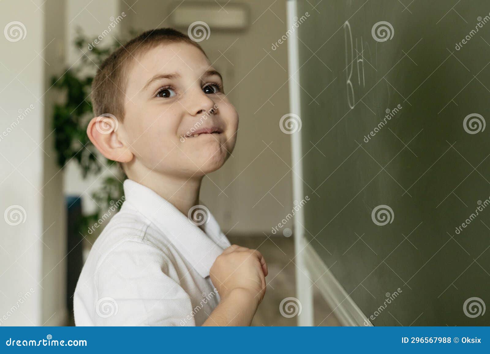 Boy Writing His Name on the Green Chalkboard Stock Photo - Image of ...
