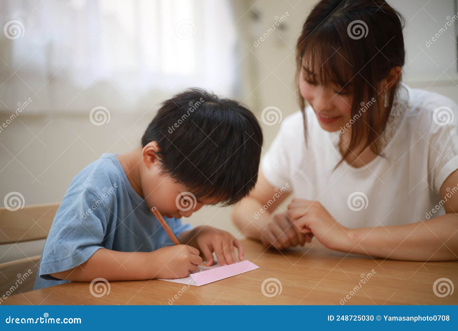 Boy writing a letter stock photo. Image of living, sitting - 248725030