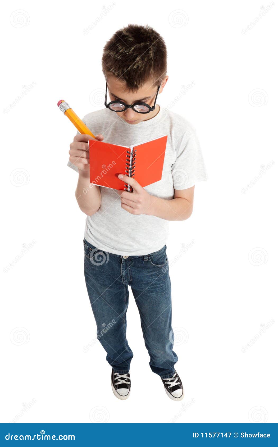 Boy writing in notebook stock image. Image of male, full - 11577147