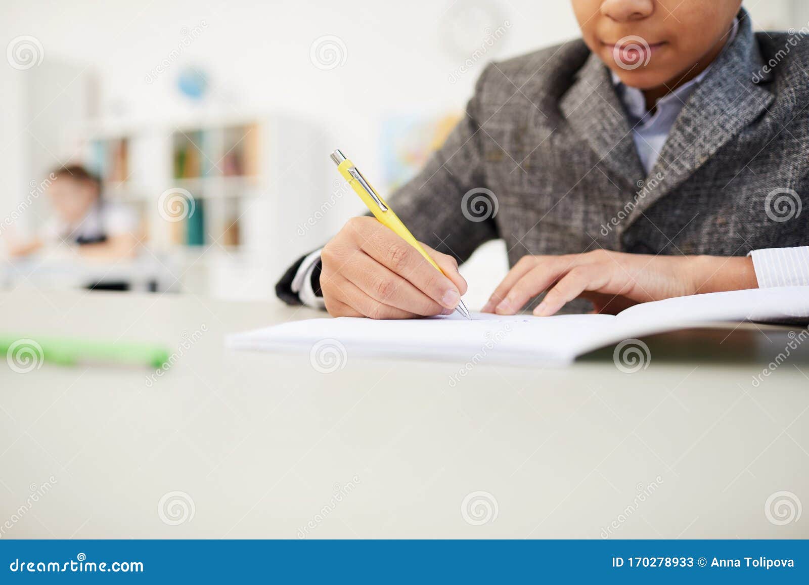 Boy writing in notebook stock image. Image of lifestyles - 170278933