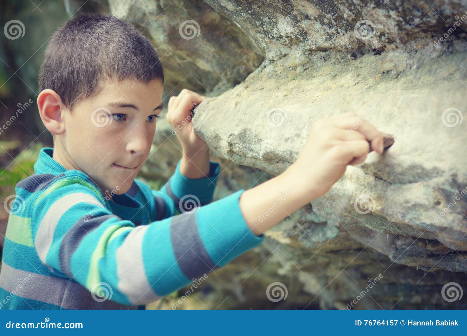 Boy Writing on Rock with a Stone Stock Image - Image of stone, outdoors ...