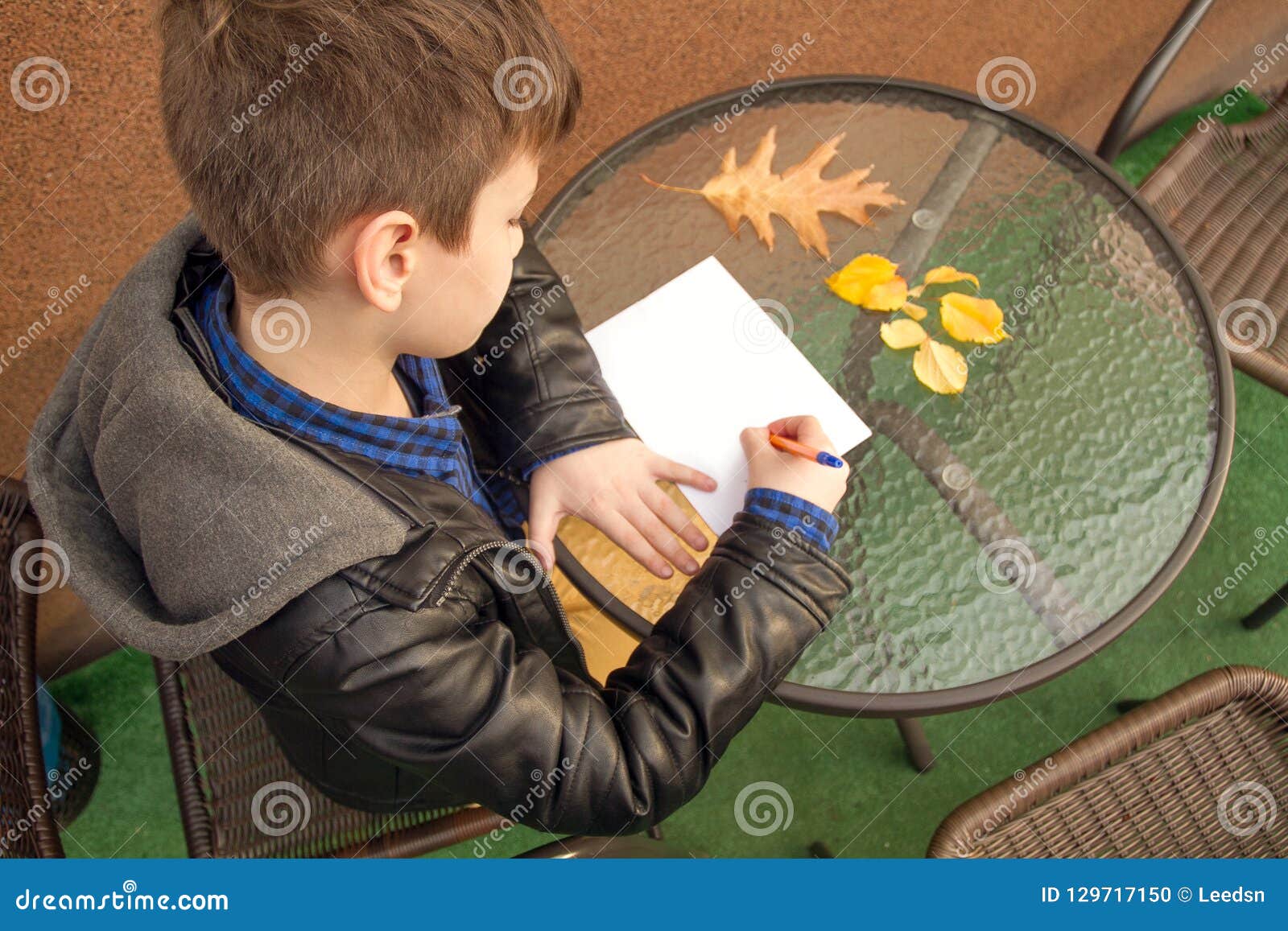 Boy is Doing Homework Outdoors Stock Photo - Image of outdoor, concept ...