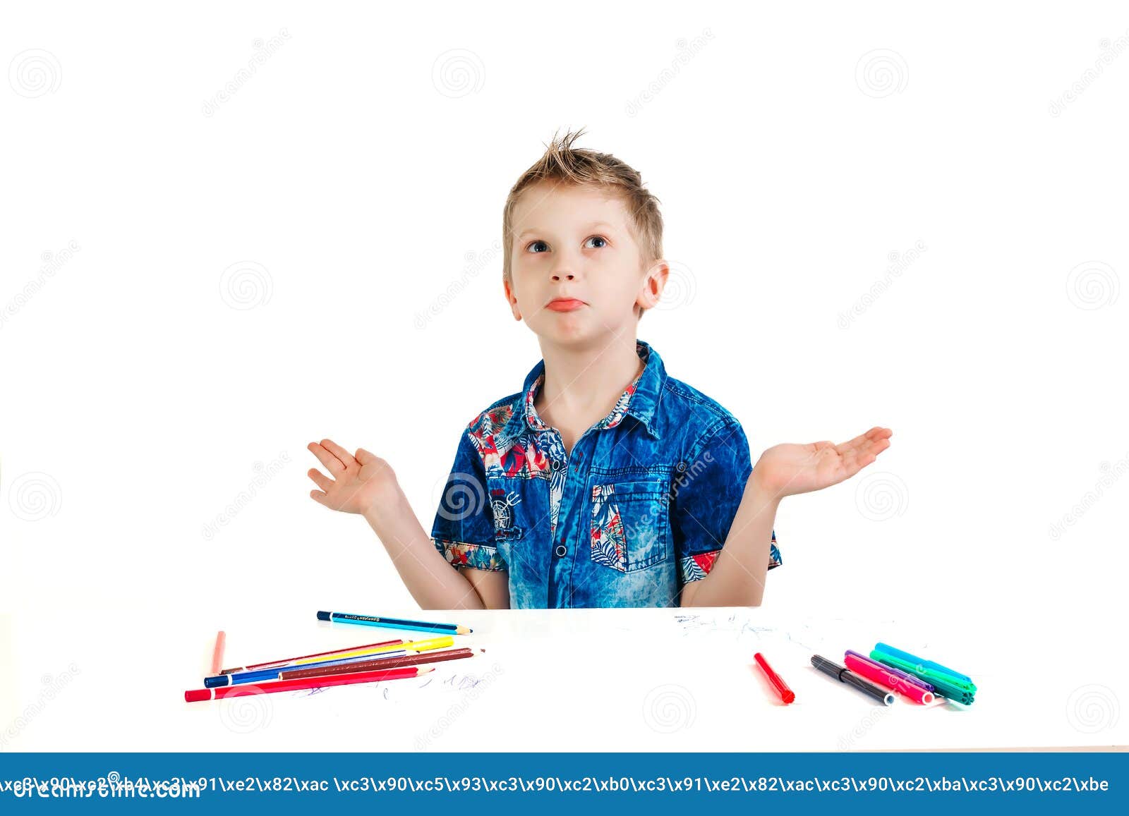 A Boy of 6 Years in a Blue Shirt Makes a Gesture on a White Background ...