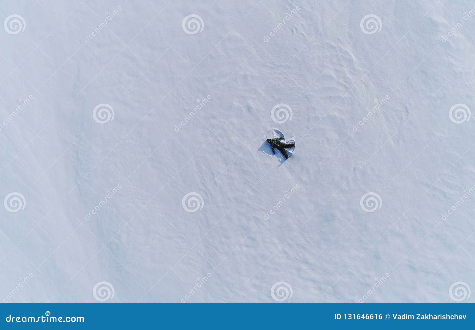 Boy of 7 Years Makes Snow Angel in Snow Area. Aerial Foto. Stock Photo ...