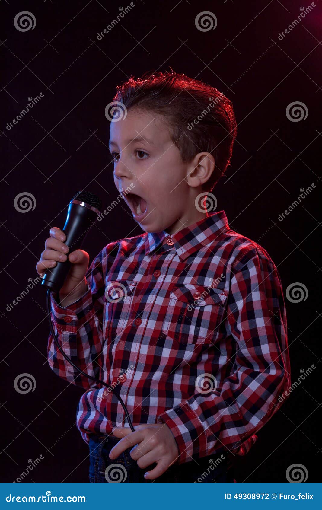 Boy yelling in microphone stock photo. Image of male - 49308972