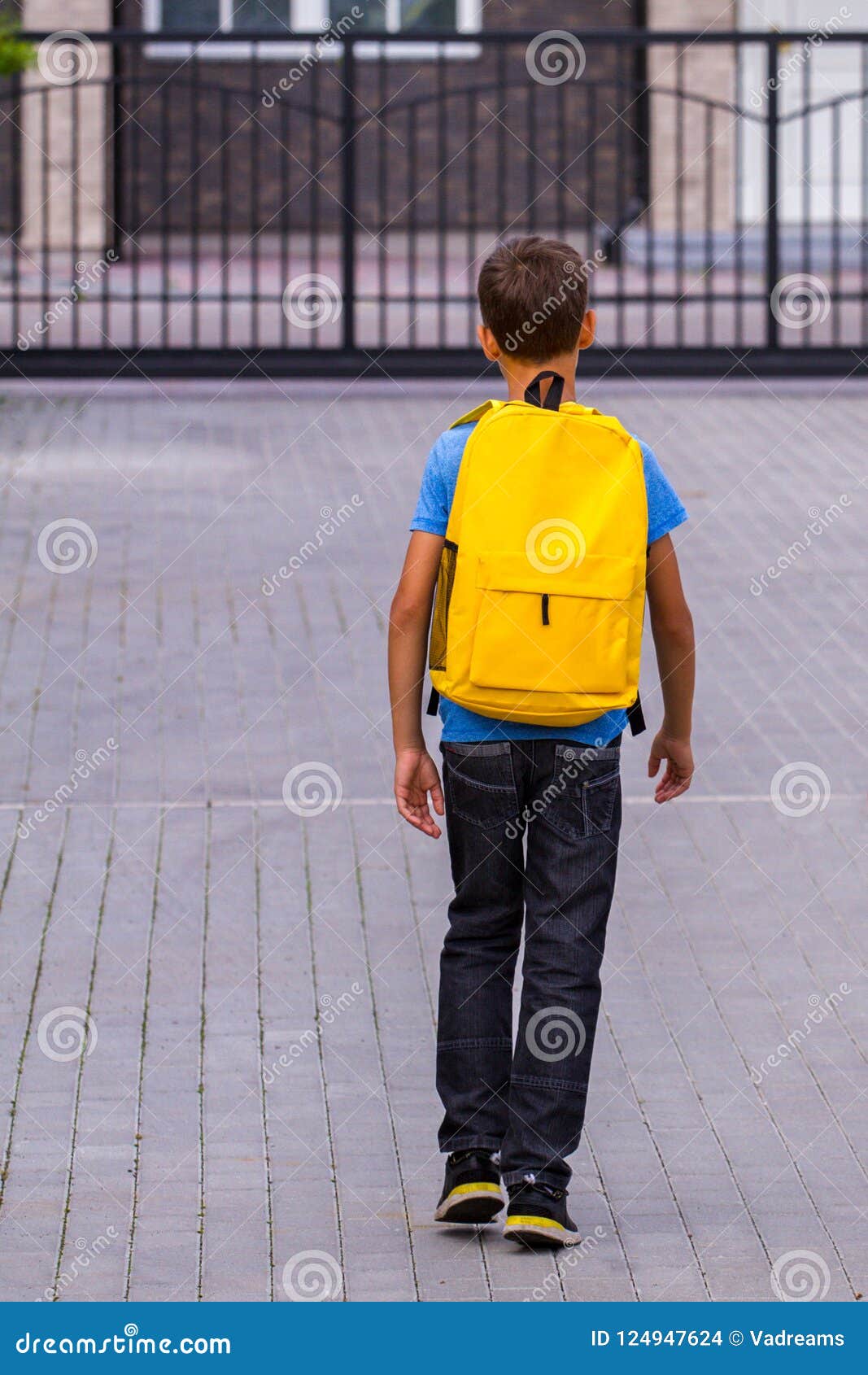 Boy with Yellow Backpack Outdoors. Back View Stock Photo - Image of ...
