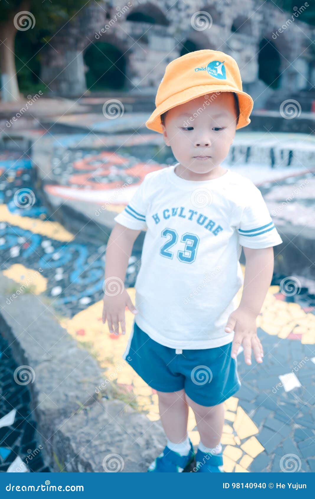 Boy with yellow hat stock photo. Image of colorful, step - 98140940