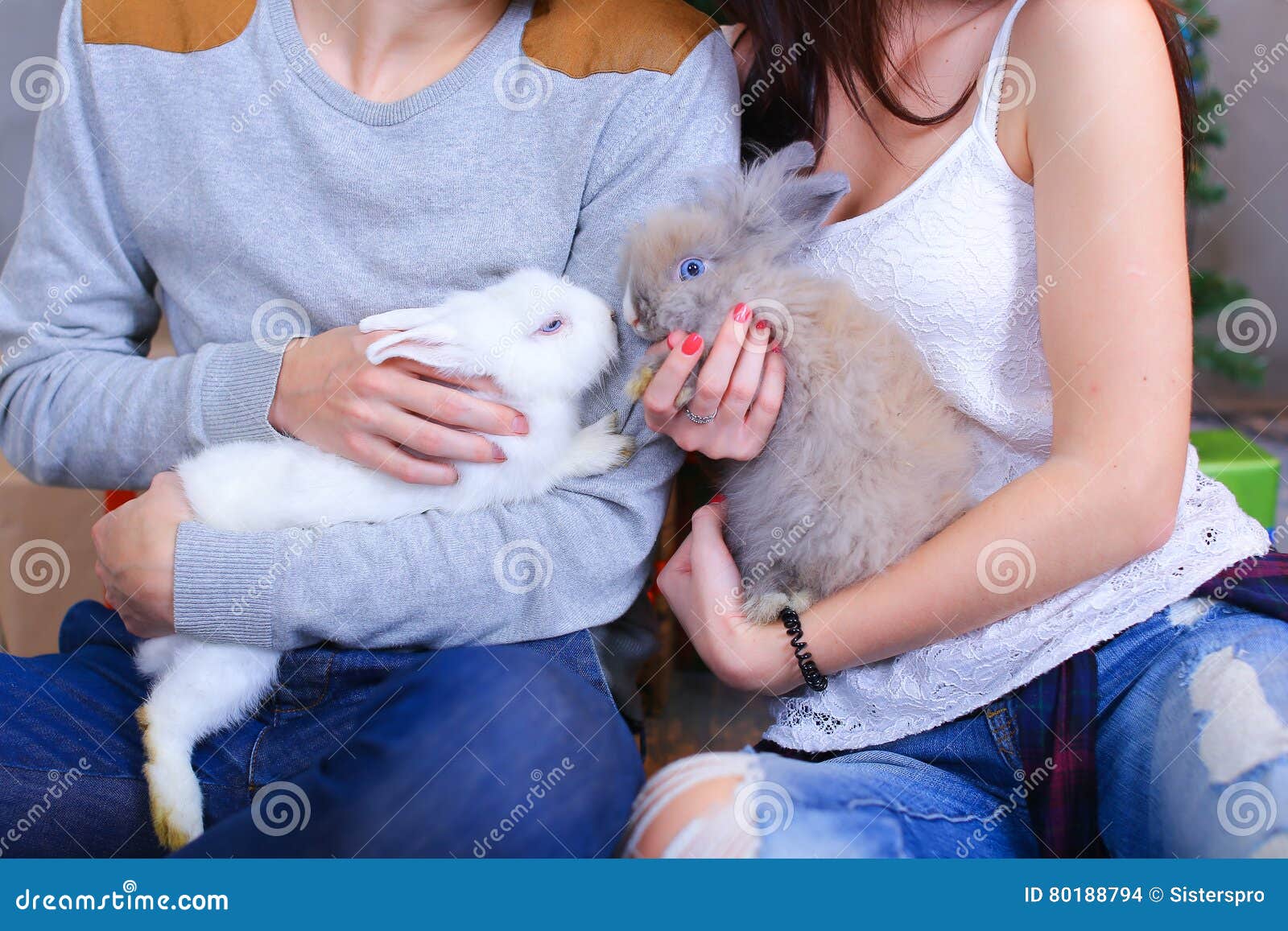 Boyfriend and Girlfriend Pose for Camera with Bunny and Laughing Stock ...
