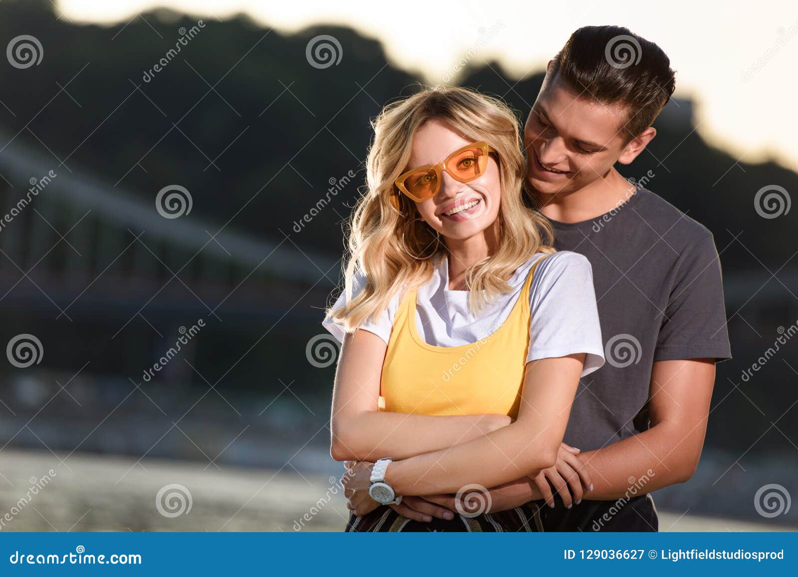 Boyfriend Hugging Smiling Girlfriend on River Beach Stock Image - Image ...