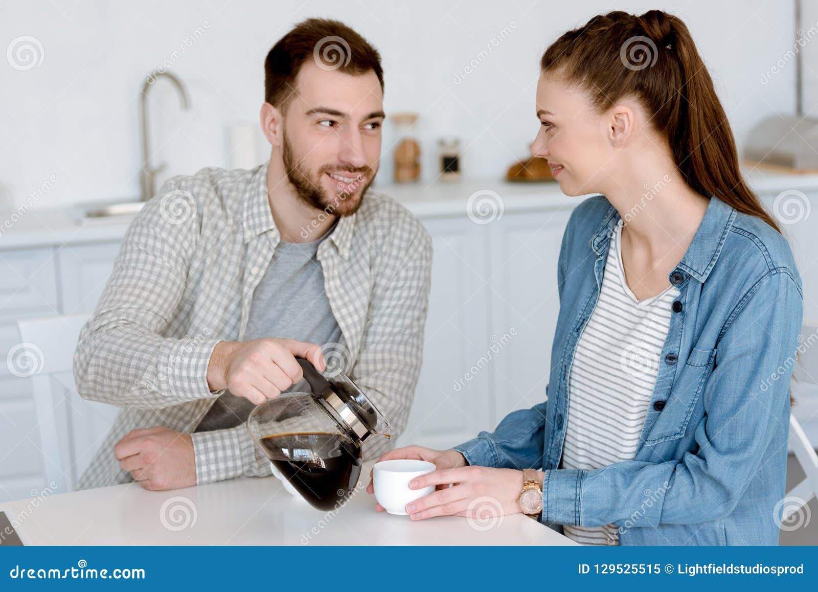 Boyfriend Pouring Coffee for Girlfriend Stock Image - Image of ...