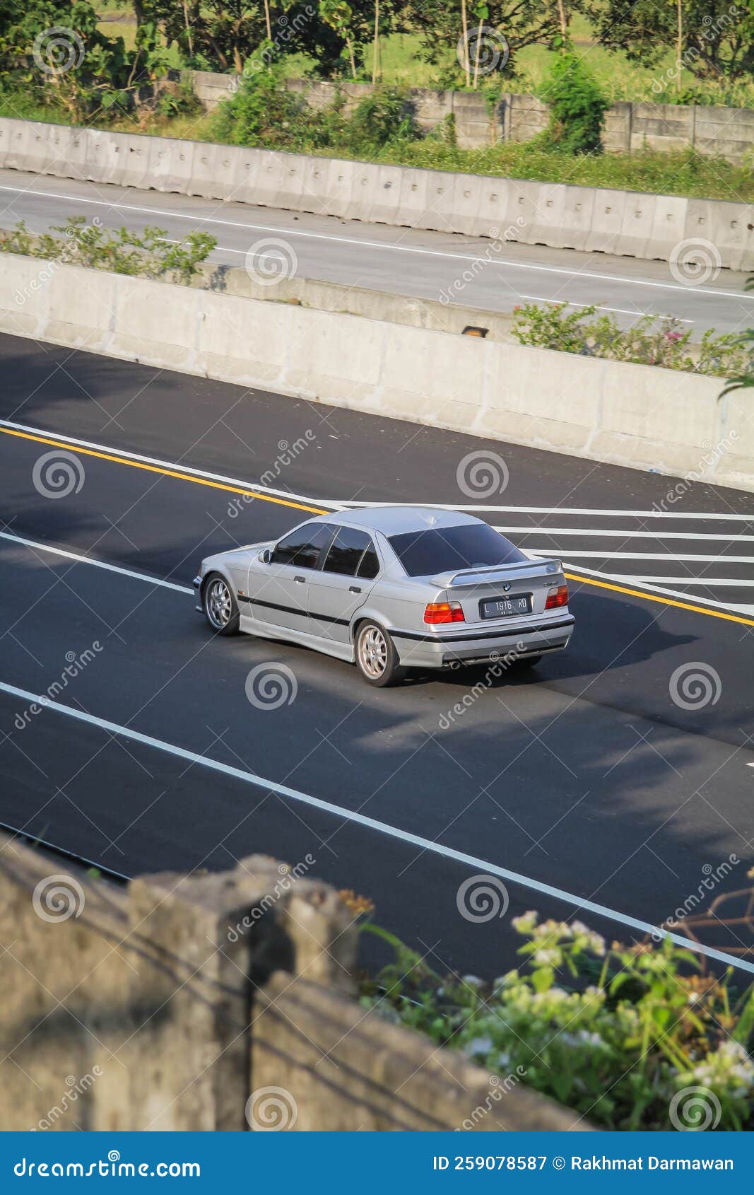 Silver BMW 318i E36 Driving Fast on Trans Jawa Highway Editorial ...
