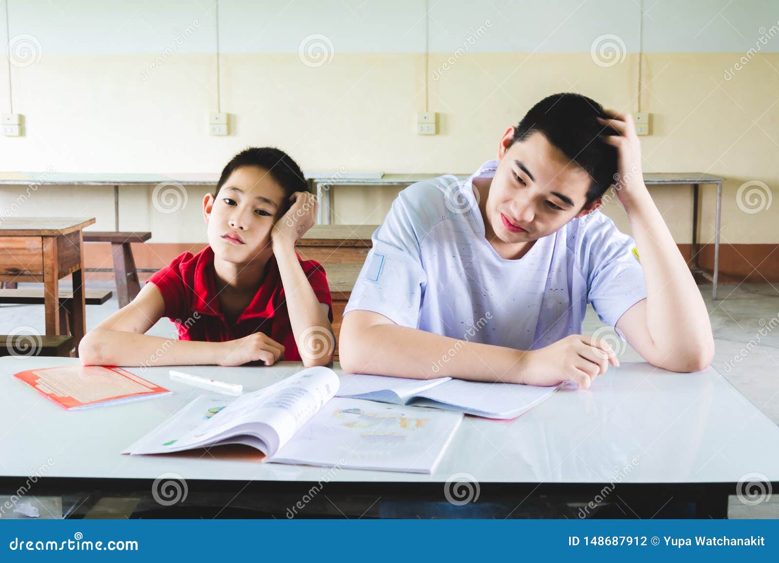 Boys are boring to study stock photo. Image of bored - 148687912