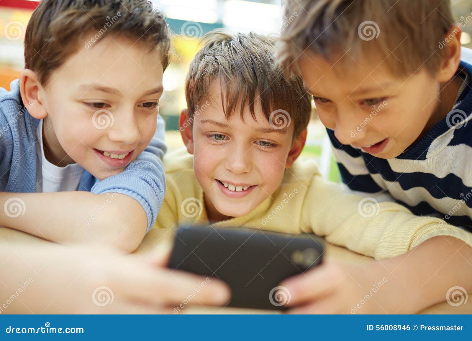 Boys with cellphone stock photo. Image of lifestyle, group - 56008946