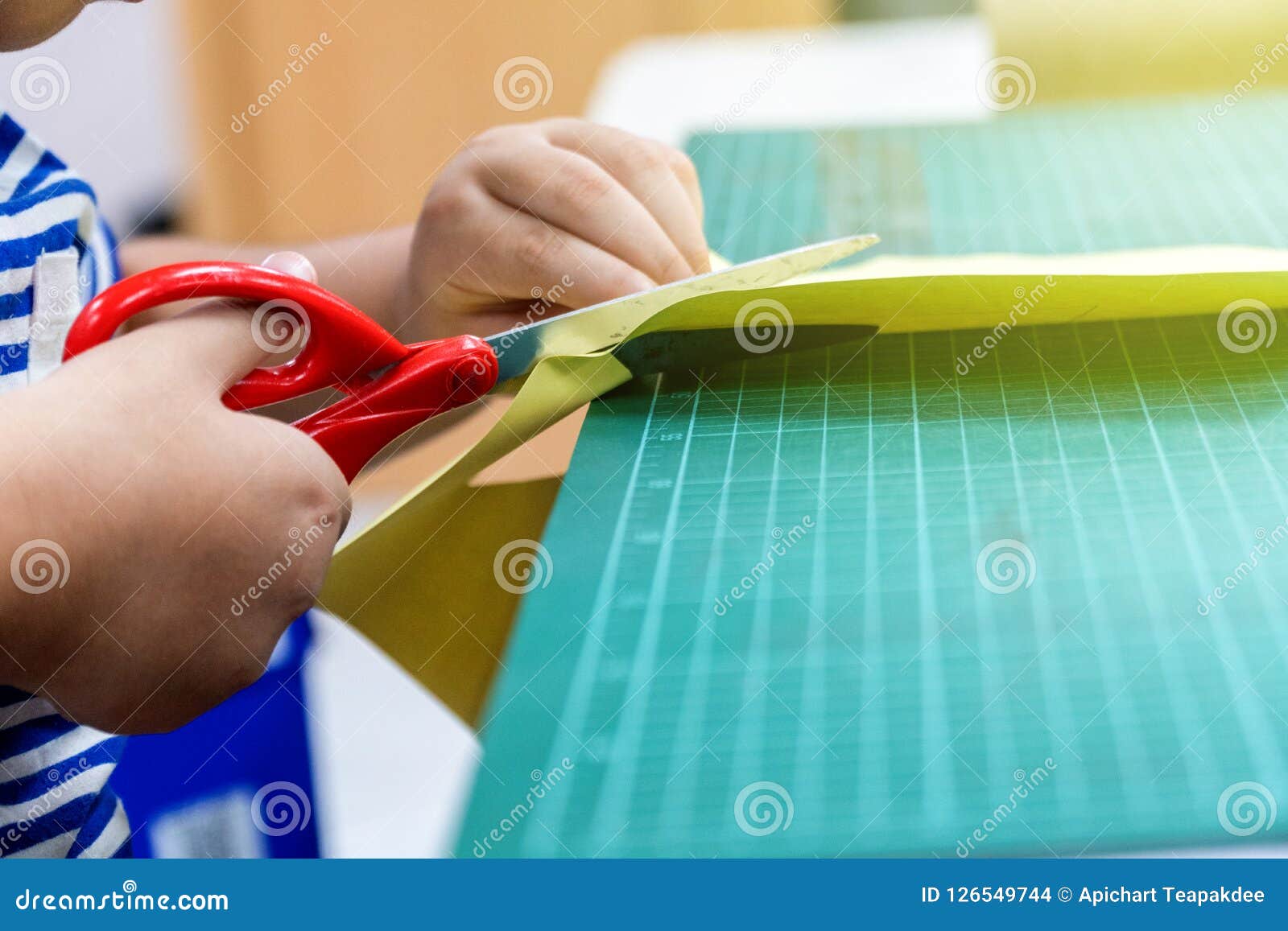 Boys are cutting the paper stock photo. Image of person - 126549744