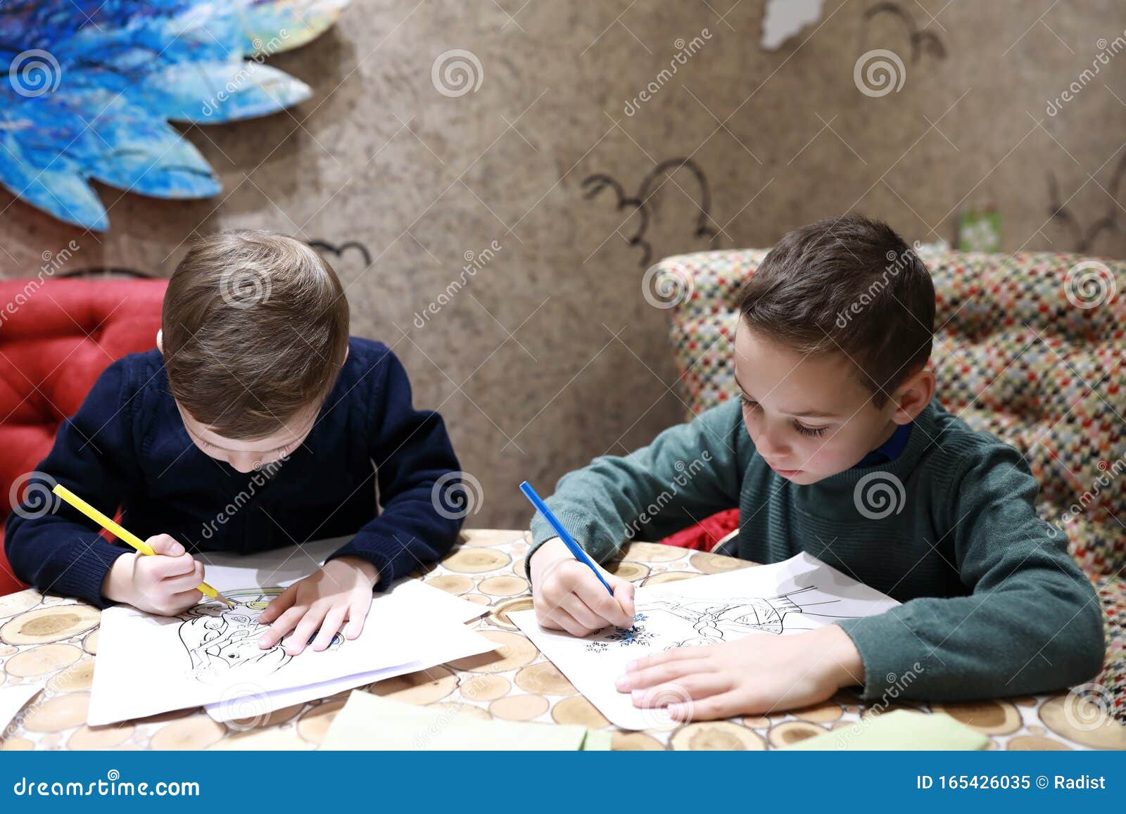 Two Boys Draw With Chalk On The Pavement. The Concept Of A Happy ...