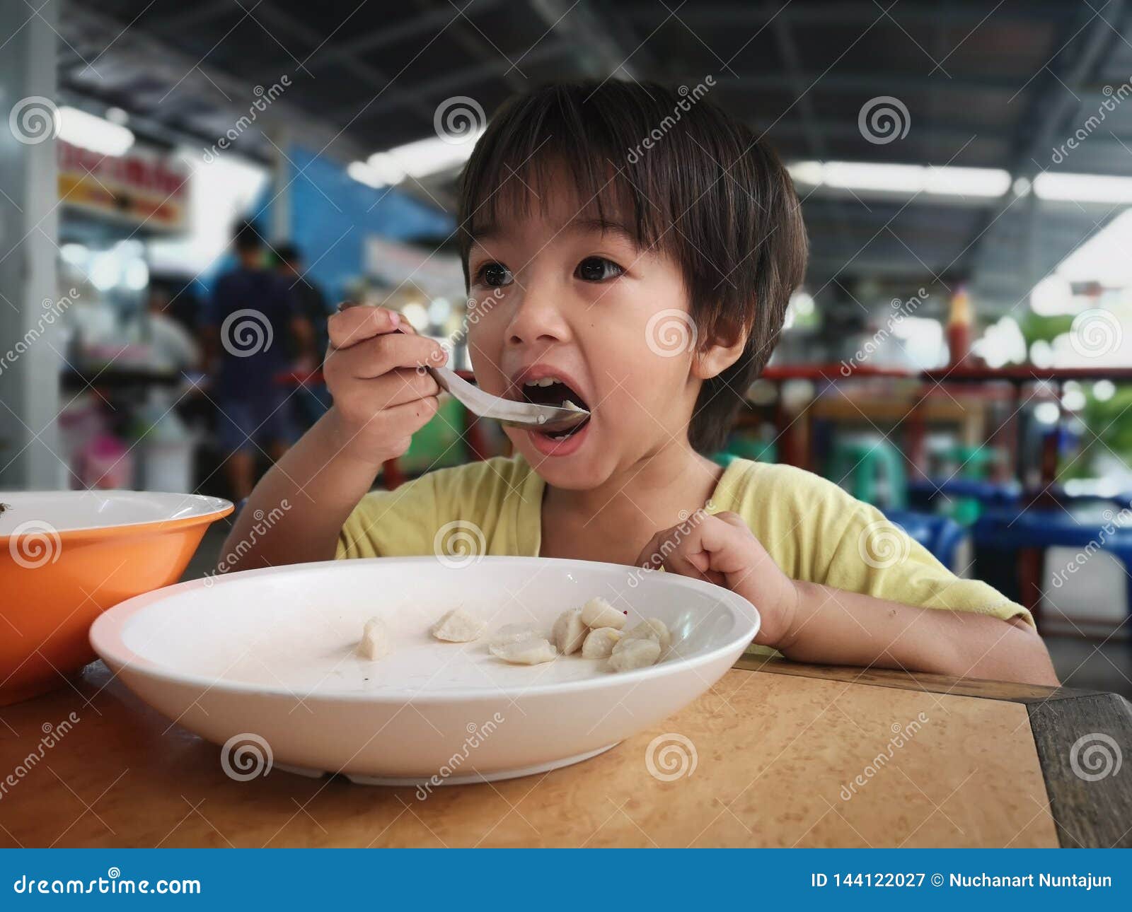 The boys eat the food. stock image. Image of people - 144122027
