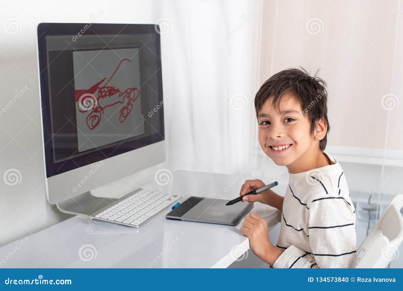 Boys Enthusiastically Draw on a Computer Using a Tablet Stock Photo ...